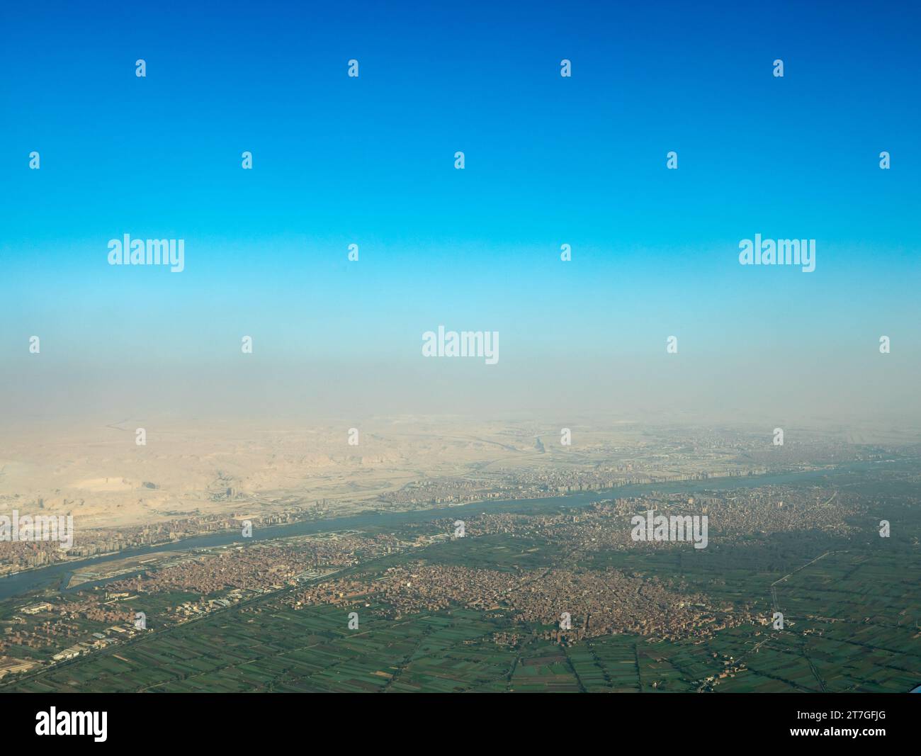 Aerial view of the fertile valley with farms and cities along banks of ...