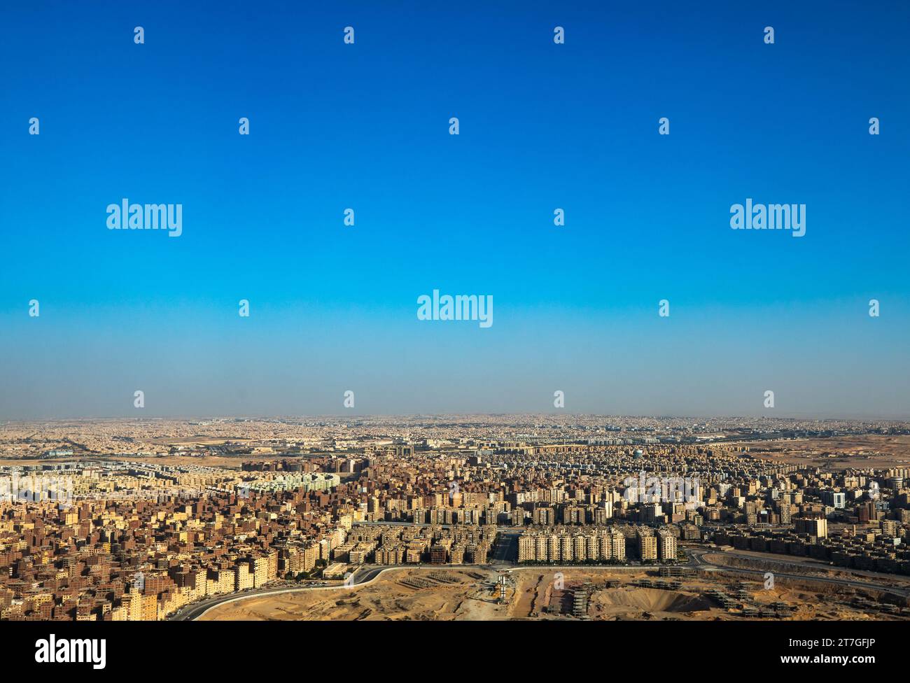 Aerial view of vast expanse of high rise apartments that crowd the city ...