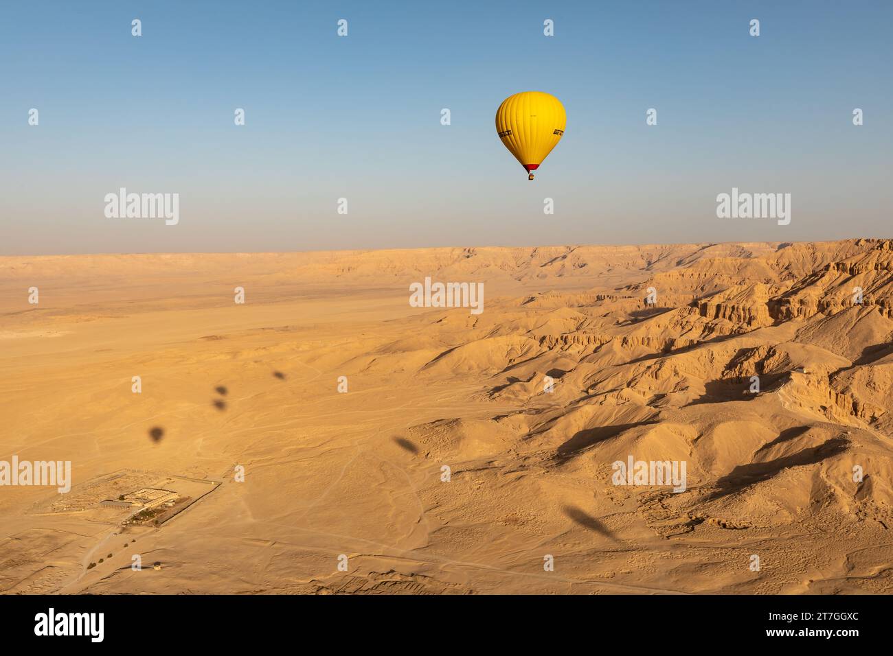 Aerial view of hot air balloons flying over archeological sites of ...