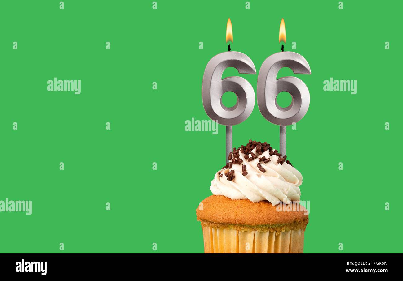 Birthday with number 66 candle and cupcake - Anniversary card on green ...
