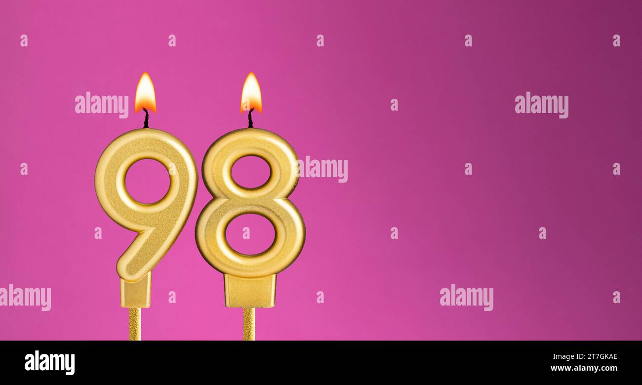Birthday card with candle number 98 - purple background Stock Photo - Alamy
