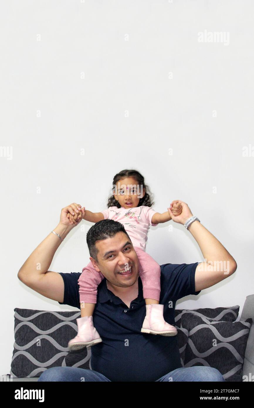 Divorced single dad and 3-year-old dark-skinned Latino daughter play ...