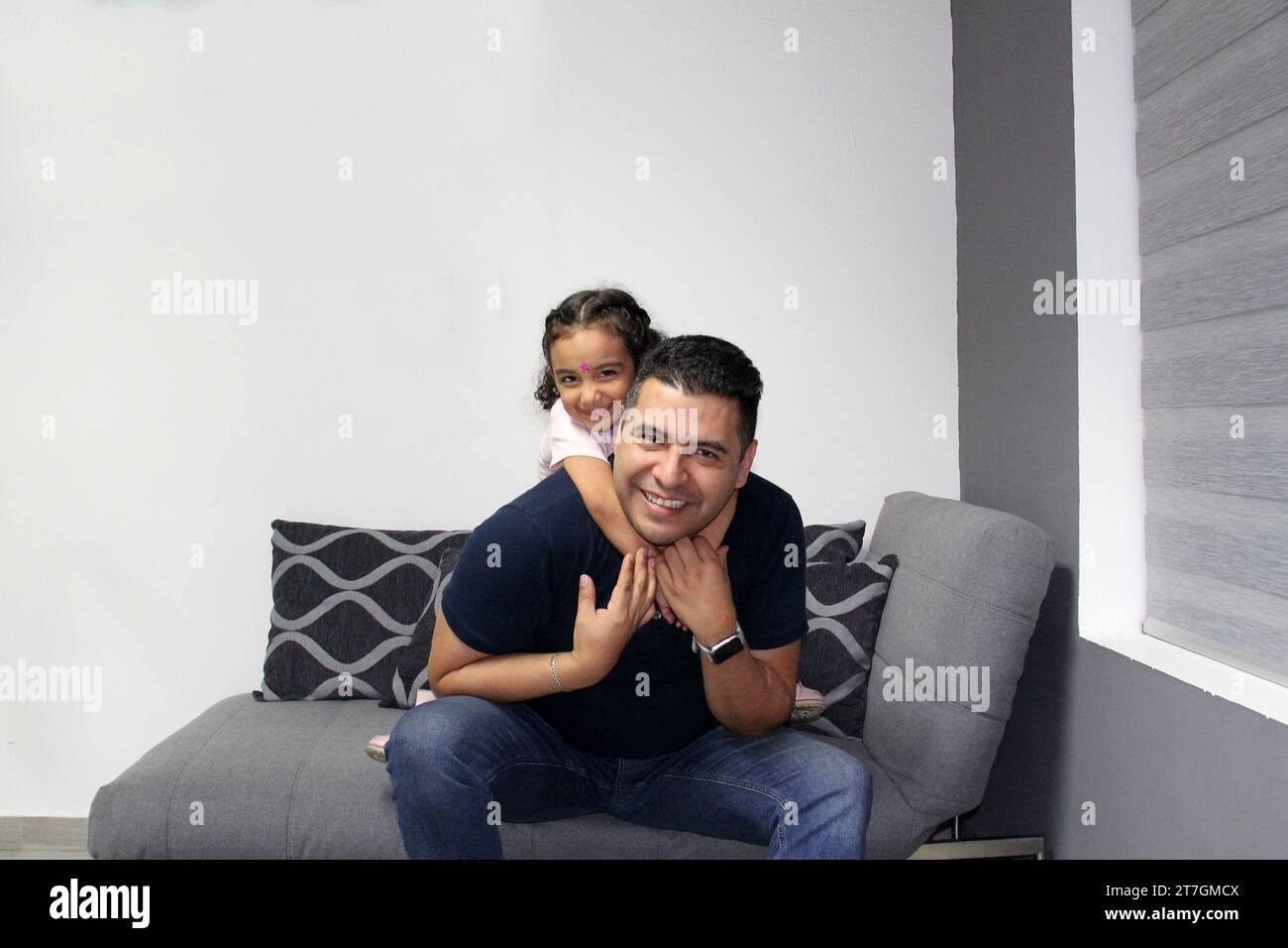 Divorced single dad and 3-year-old dark-skinned Latino daughter play ...