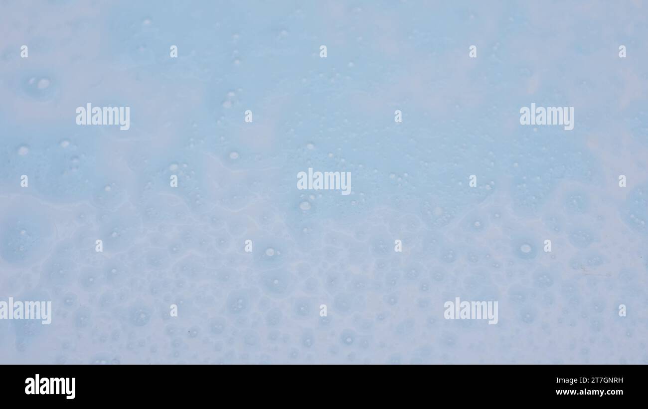blue soap foam texture on white background Stock Photo - Alamy
