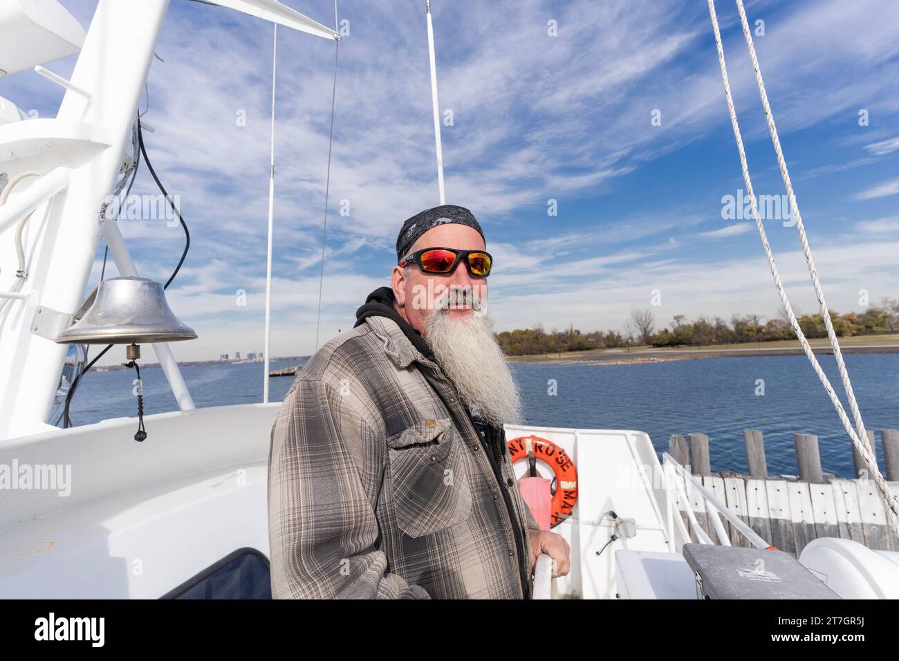 Captain of ferry between The Bronx City Island and Hart Island Phil ...