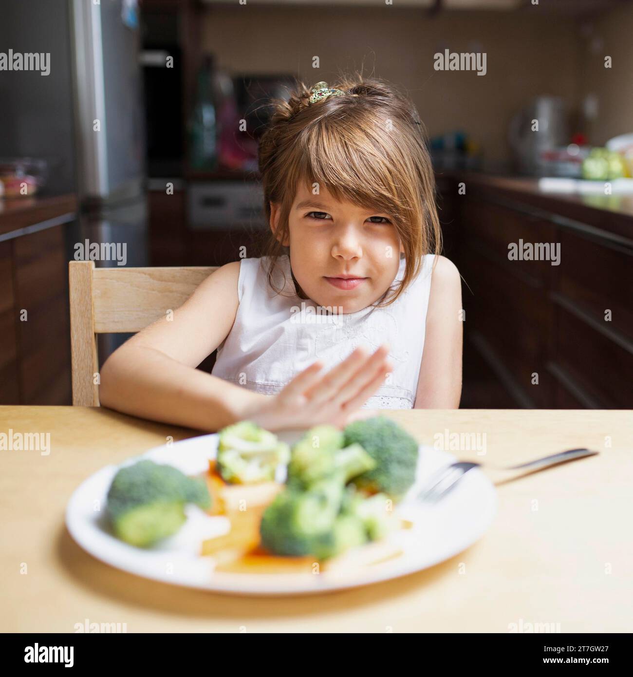 Baby girl having enough healthy food Stock Photo - Alamy