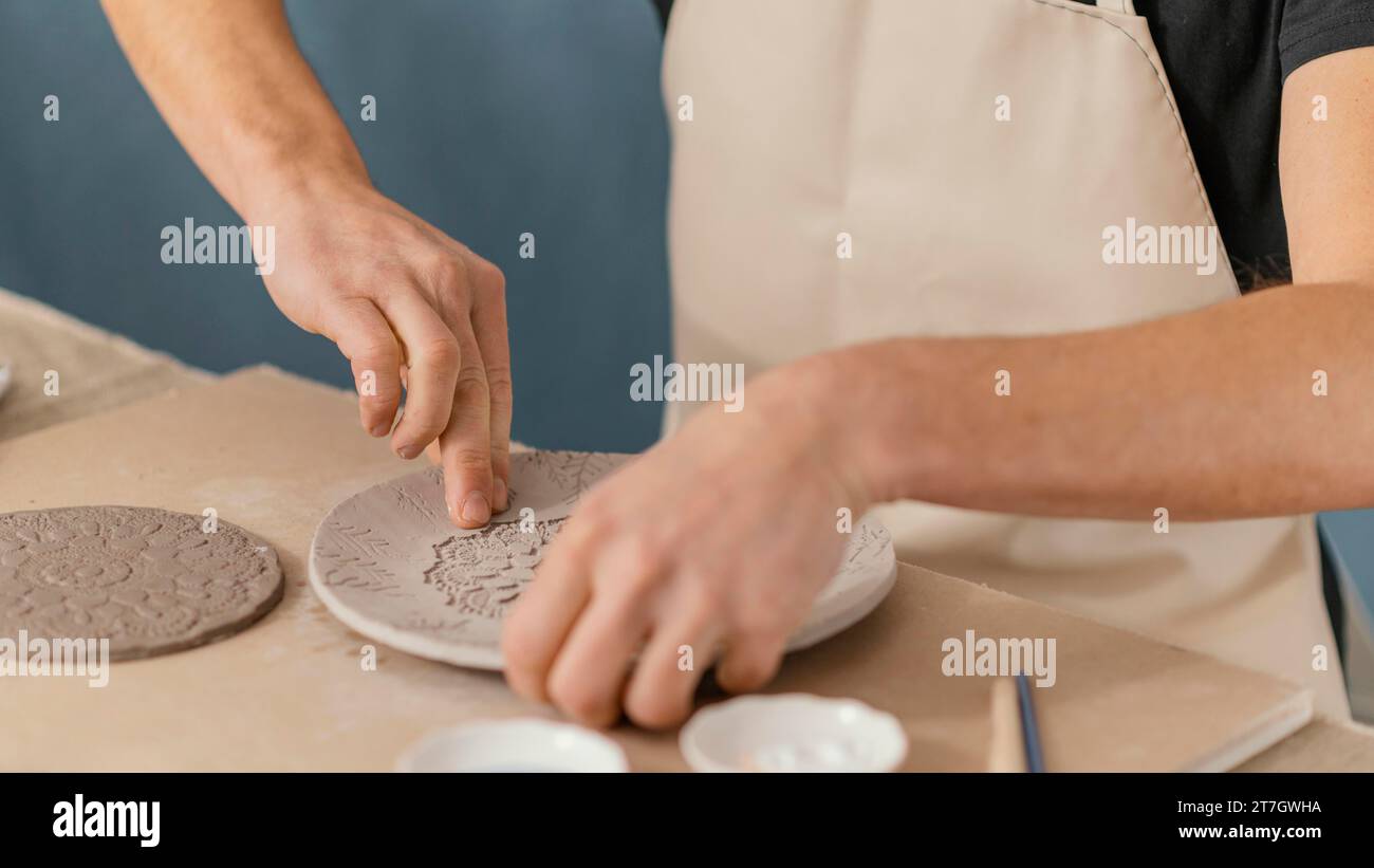 Close up hands doing pottery Stock Photo - Alamy