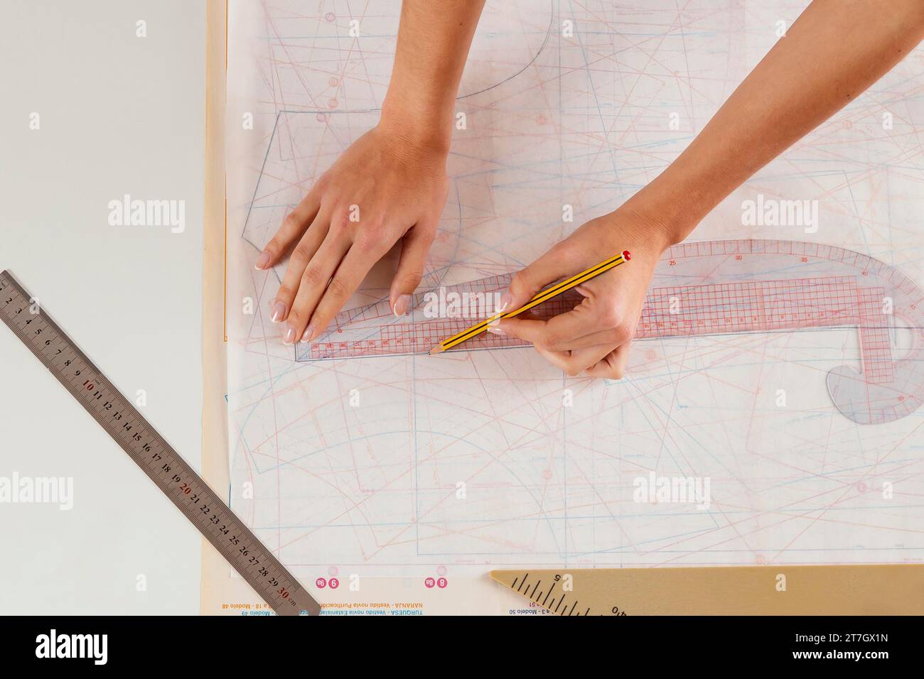 Close up woman measuring with ruler Stock Photo - Alamy