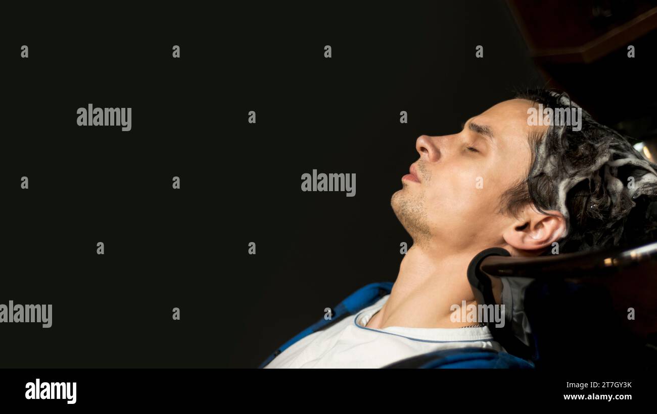 Man getting hair wash hi-res stock photography and images - Alamy