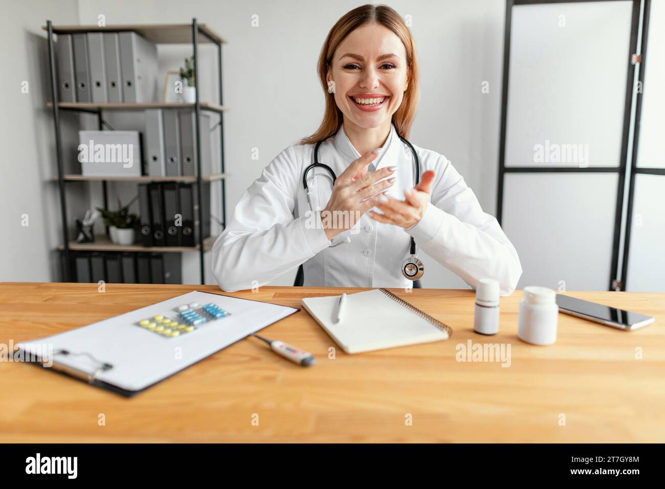 Medium shot smiley doctor work Stock Photo - Alamy