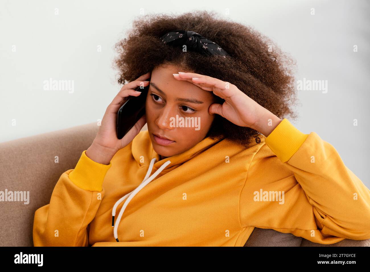 Medium shot girl talking phone Stock Photo - Alamy