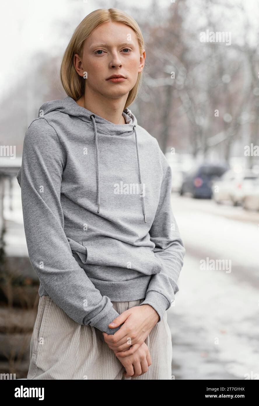 Medium shot woman posing outdoors 2 Stock Photo - Alamy