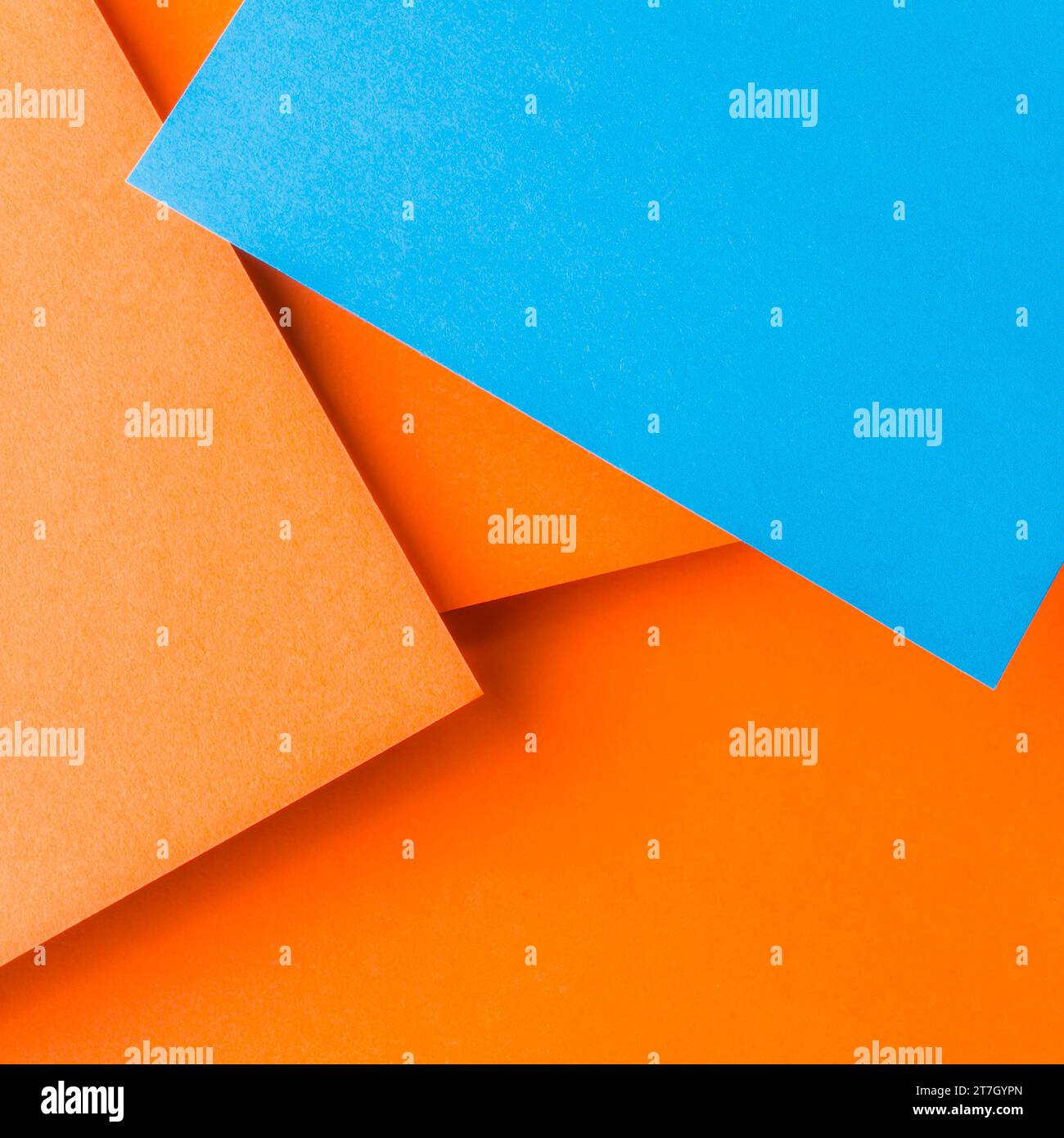 Overhead view blue craft paper plain orange background Stock Photo - Alamy