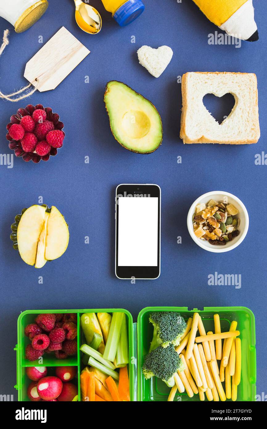 Phone around meal concept Stock Photo - Alamy