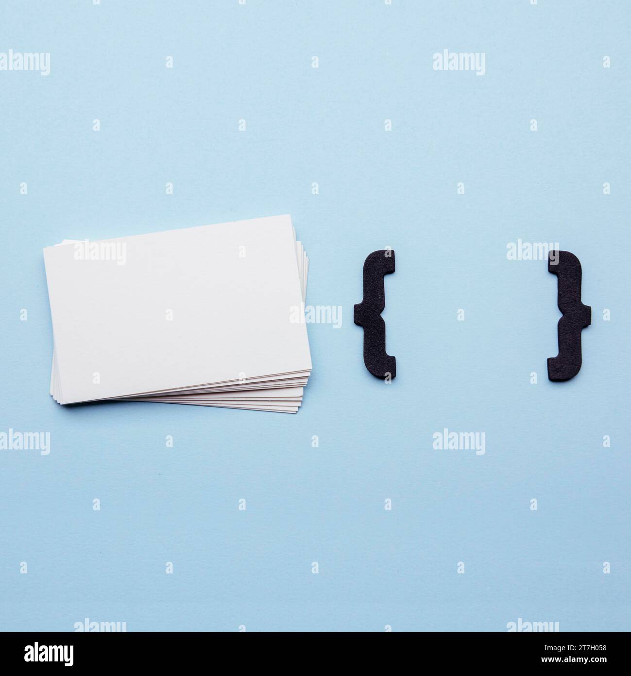 Stationery business visiting cards curly brackets Stock Photo - Alamy