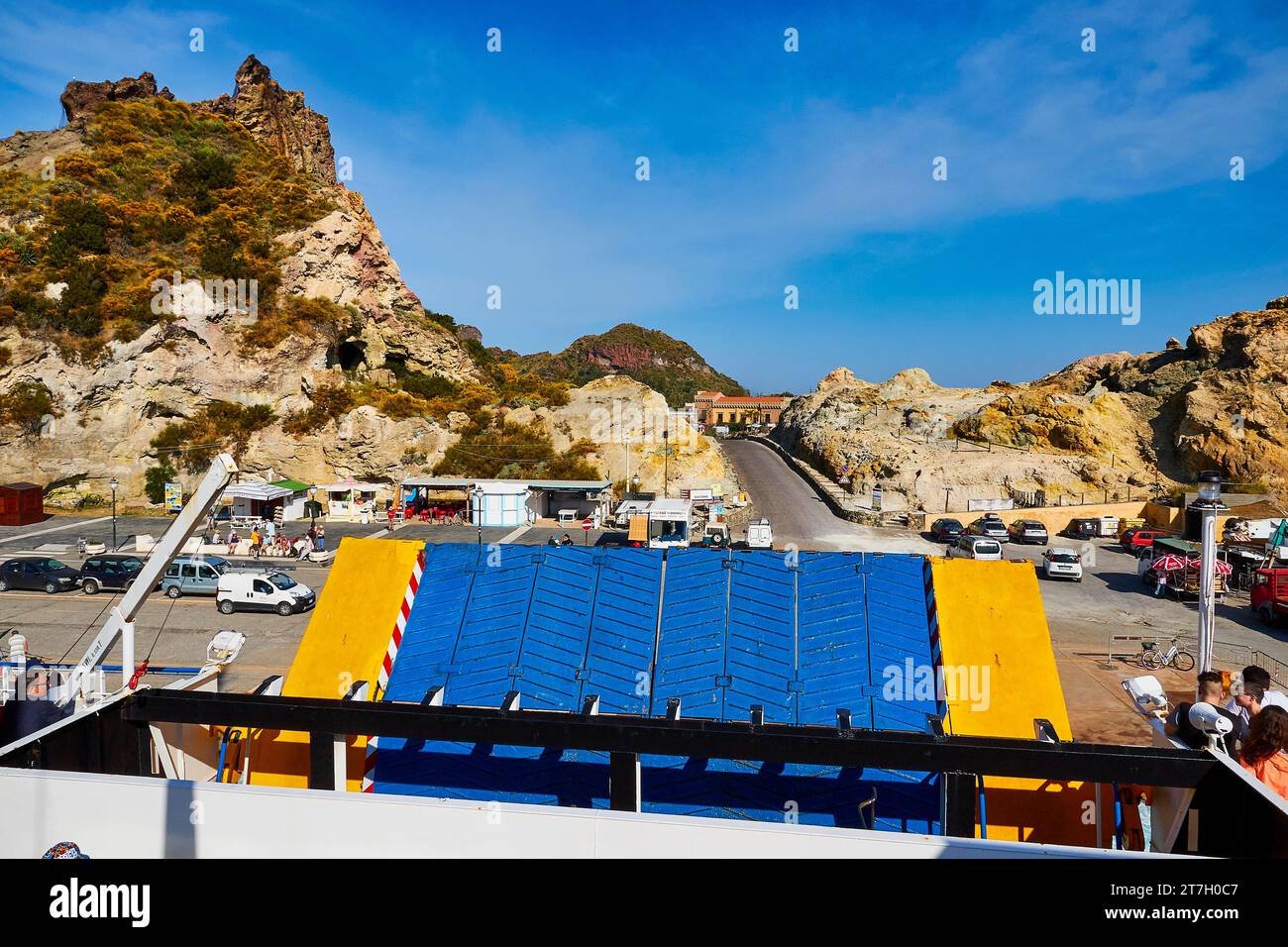 Ferry, mooring manoeuvre, tailgate. from the ship, cars, lava rocks ...