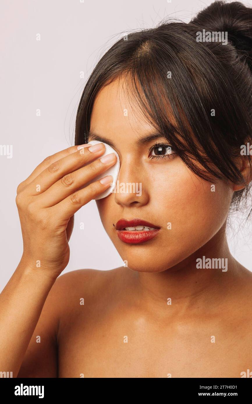 Woman removing her makeup hi-res stock photography and images - Alamy