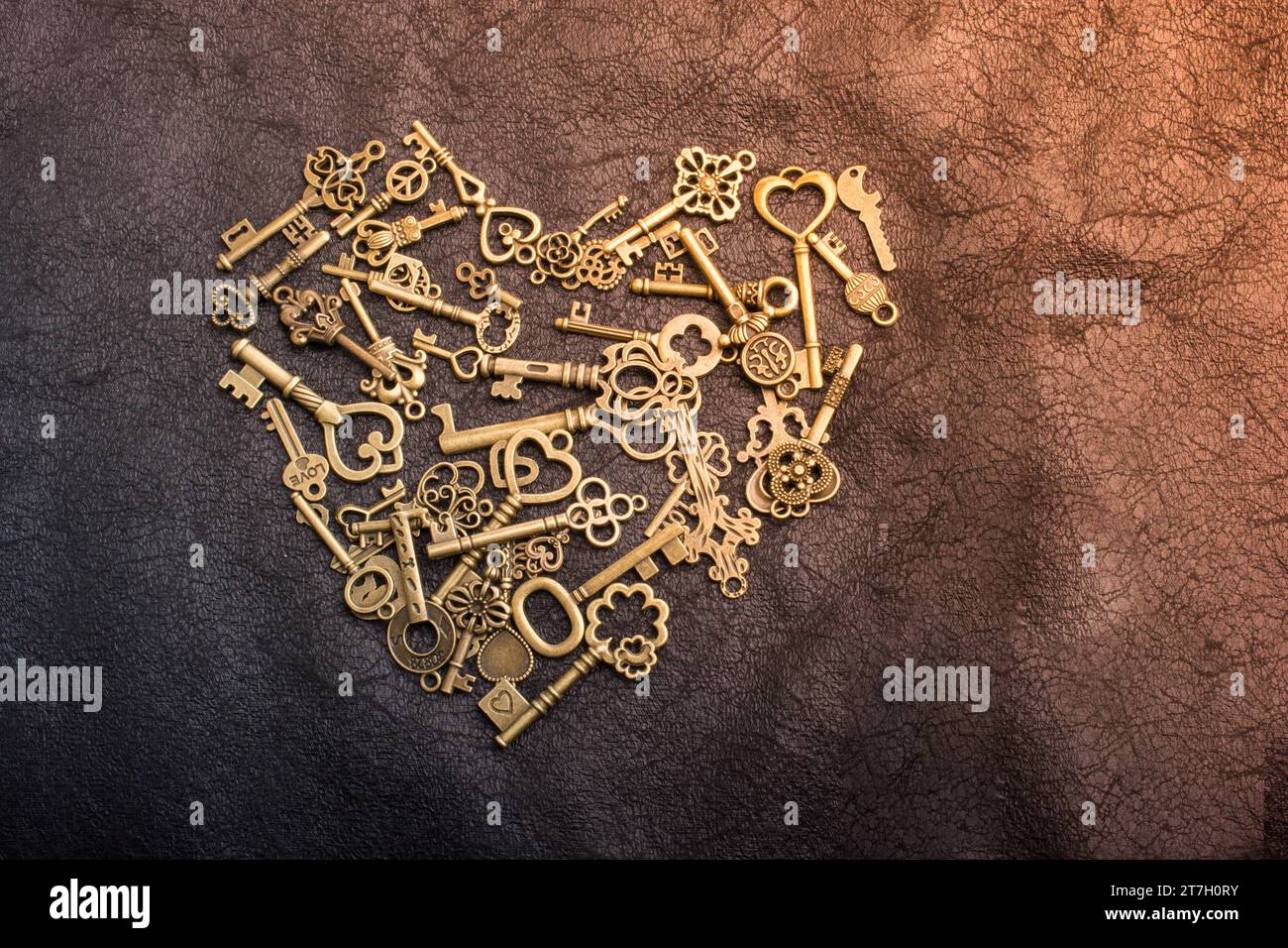 Retro metal keys form a heart shape on black Stock Photo - Alamy