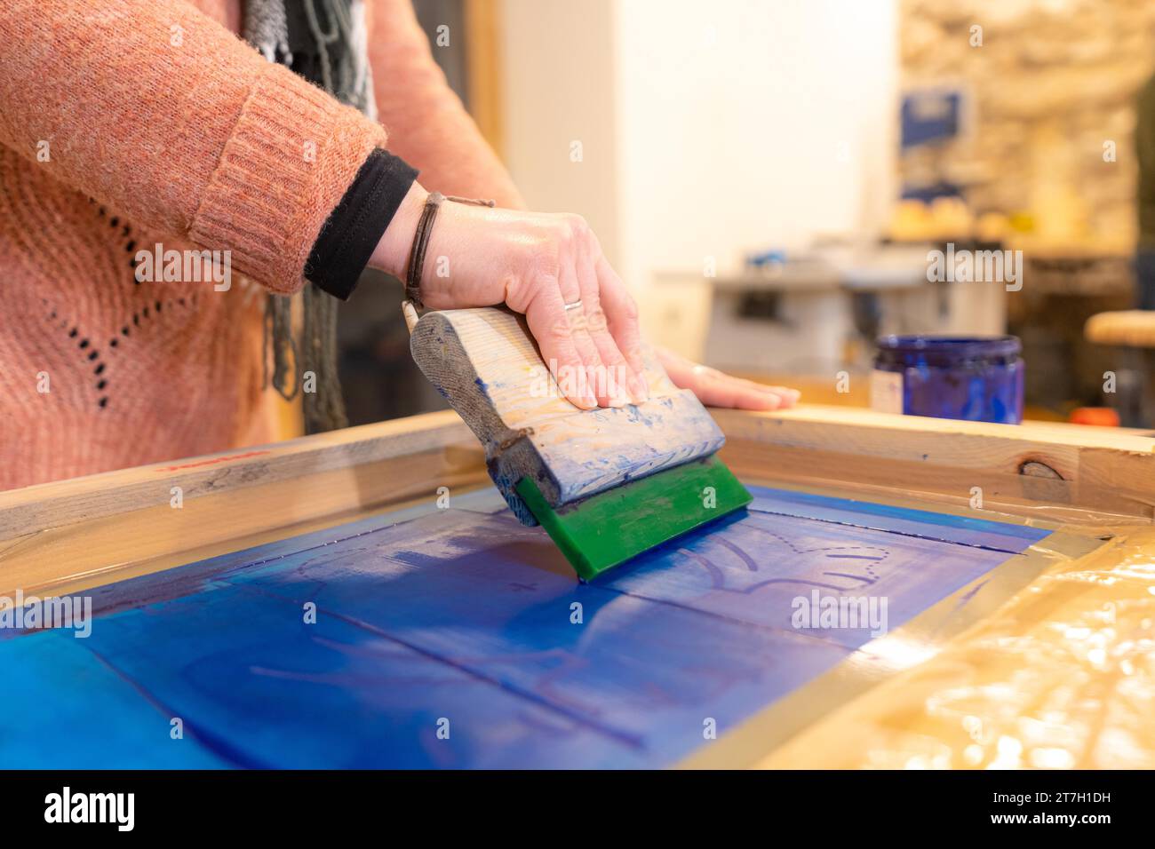 Close-up of an artist and printmaker working a printing press Stock ...