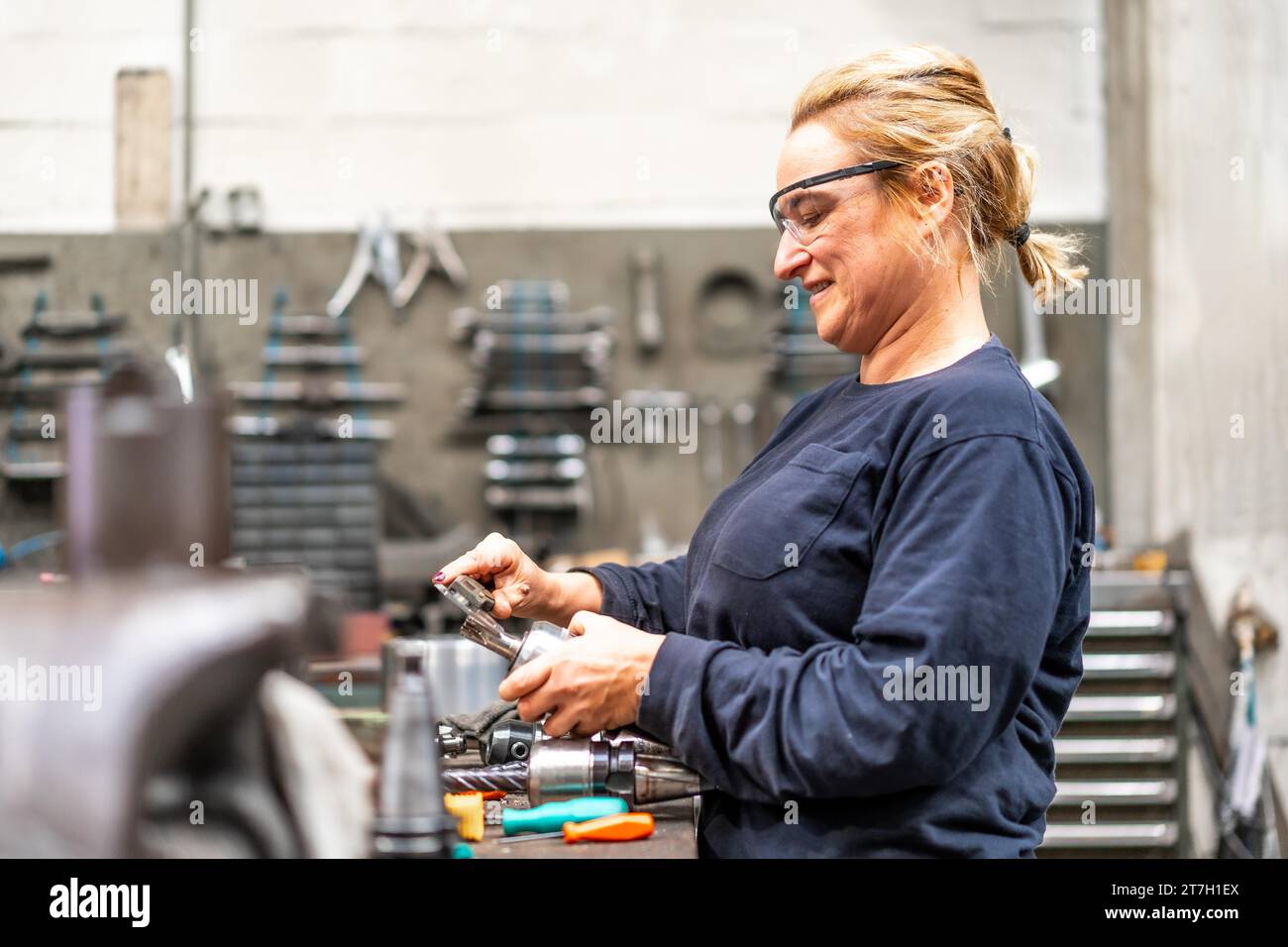 Female factory worker operator working in numerical control sector ...