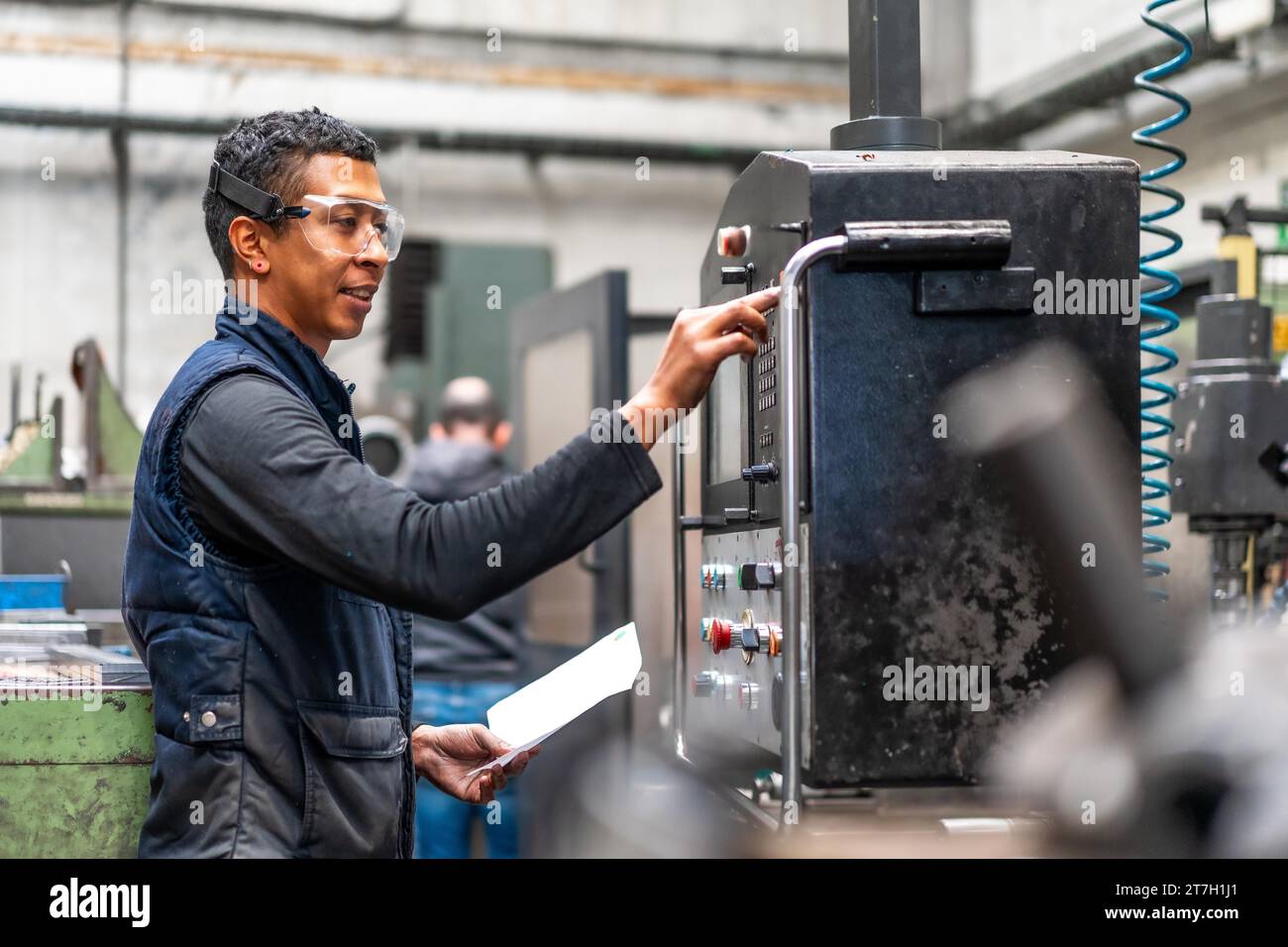 Latin worker operator of the metal industrial factory trade of the ...