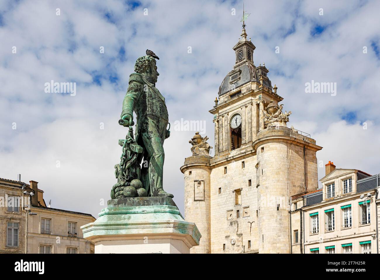 Statue of Victor Guy Duperre in front of the medieval clock tower in La ...