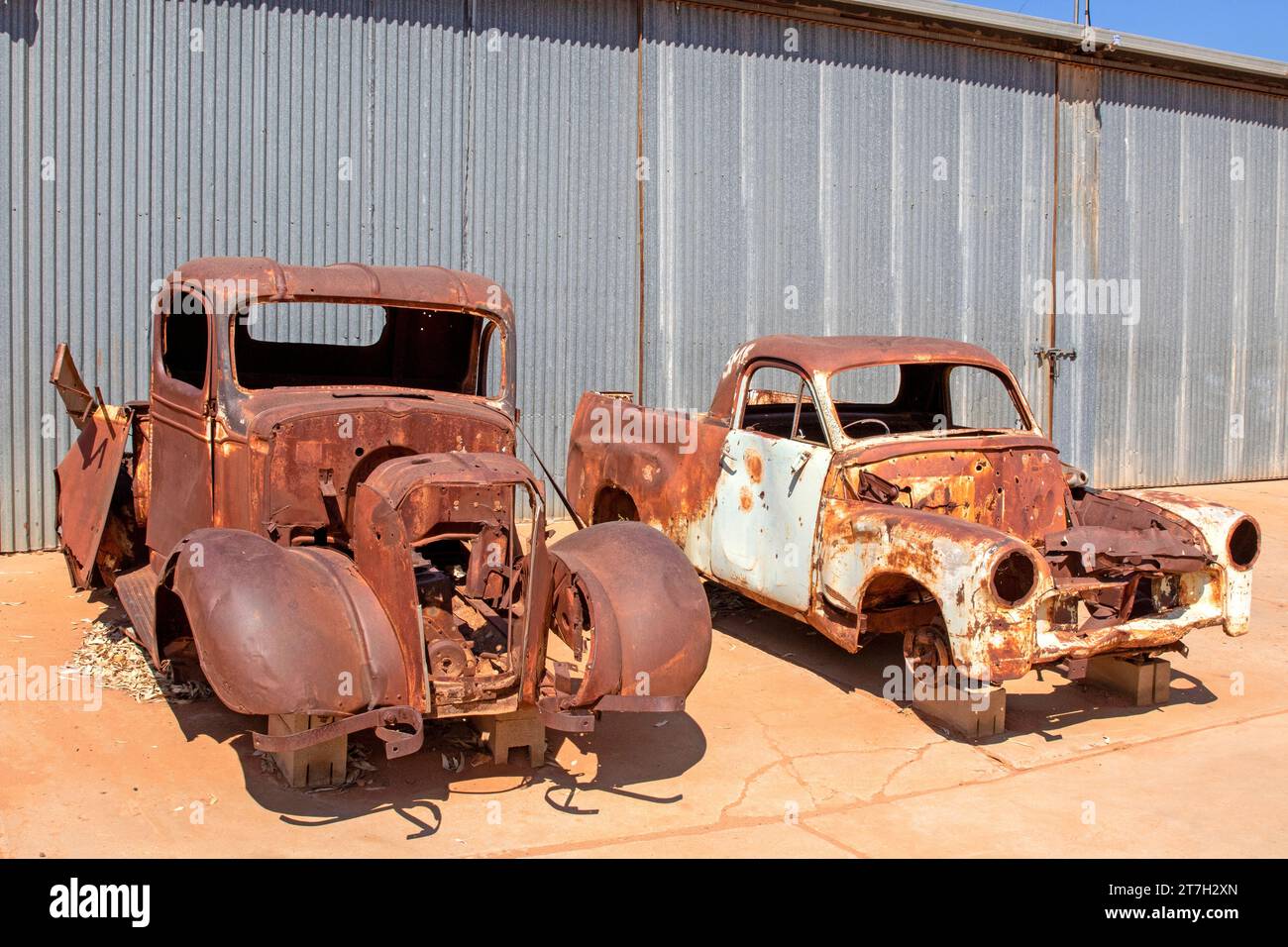 Old vehicles outside the garage workshops at Hermannsburg Historic ...