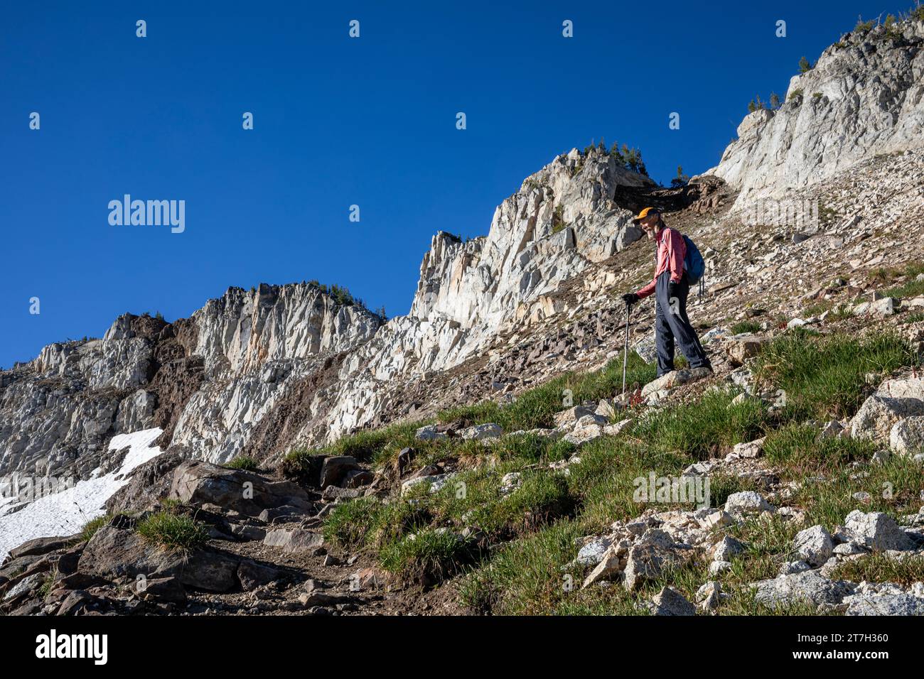 OR02731-00...OREGON - Hiker descending the Eagle Cap Trail in the Eagle ...