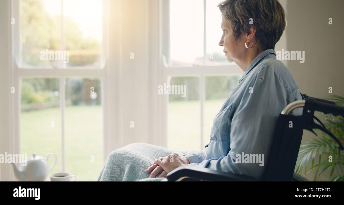 Wheelchair, senior woman or thinking of memory by window in nursing home or retirement with ...