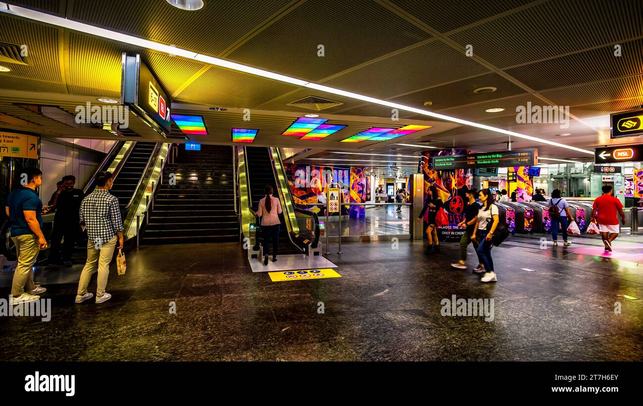 Passengers moving in and out of Automatic Fare Collection Gates at ...