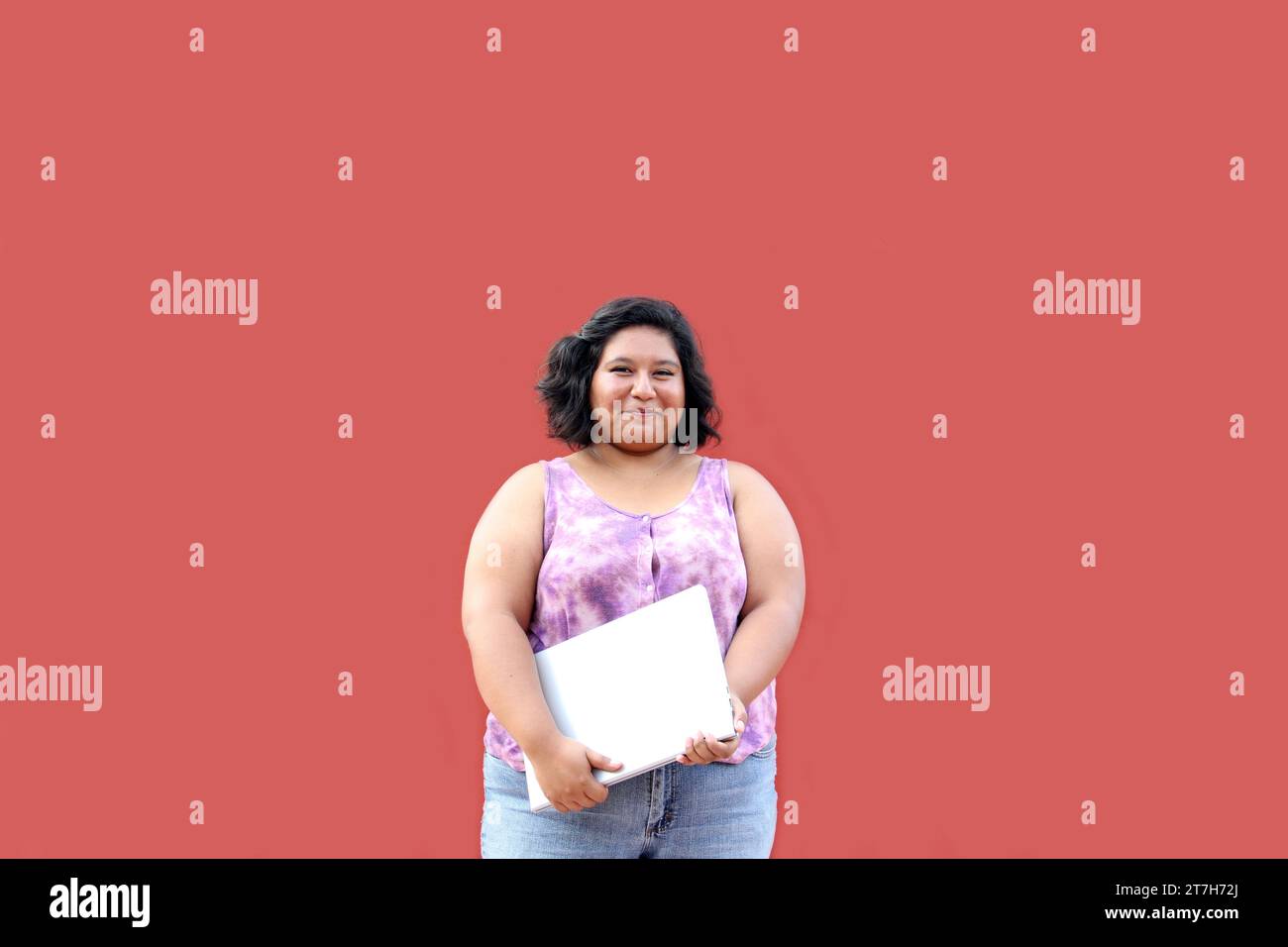 Young overweight 20 year old Latina brunette woman uses her laptop to ...