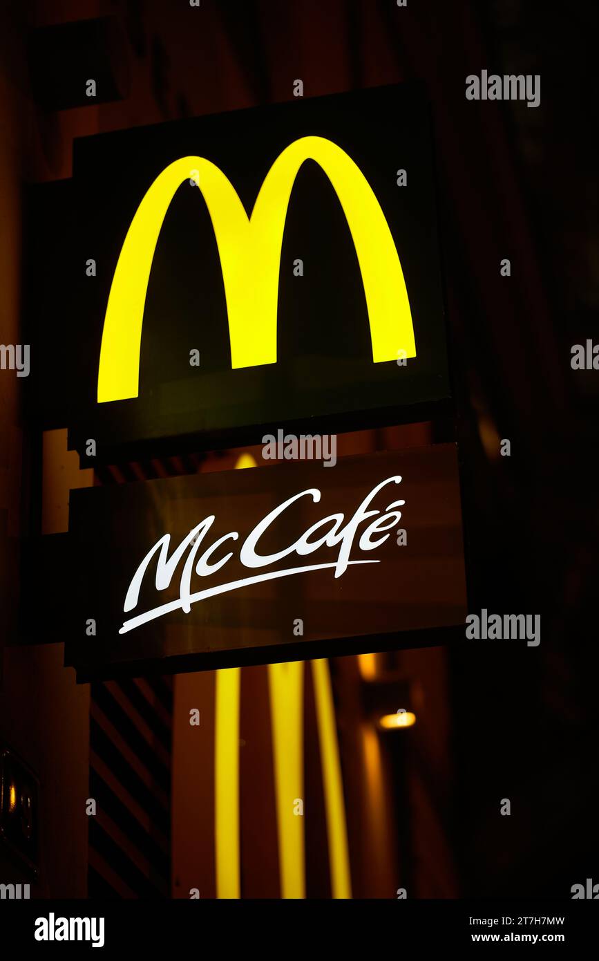 Illuminated sign of McCafé, part of the fast food chain McDonald's in ...