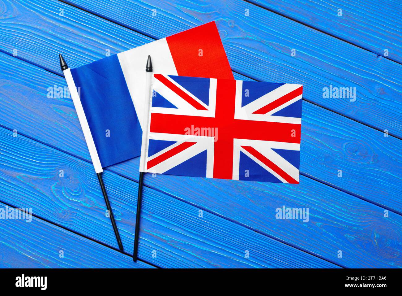 Flags of France and Great Britain on blue wooden background Stock Photo ...