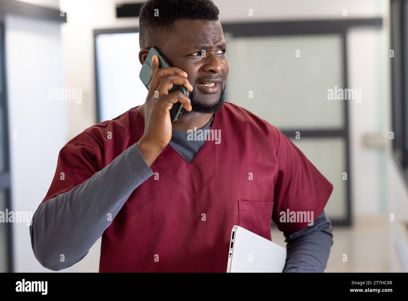 African american male doctor talking hi-res stock photography and ...