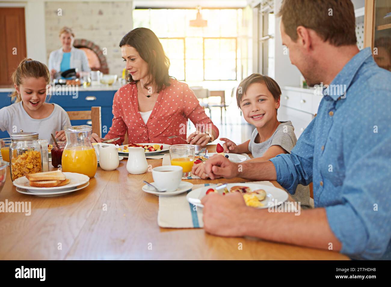 Food, breakfast and love with a family in the dining room of their home ...