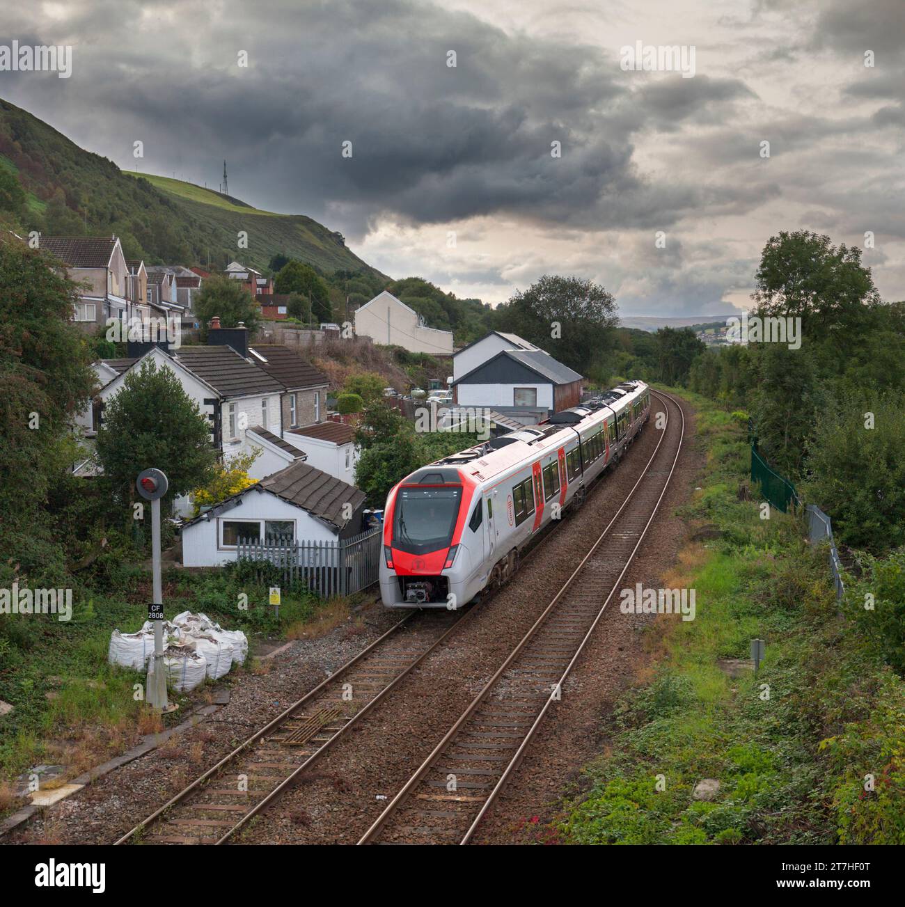 Transport For Wales class 231 Stadler FLIRT DMU train 231009 departing from Tir-Phil, in the ...