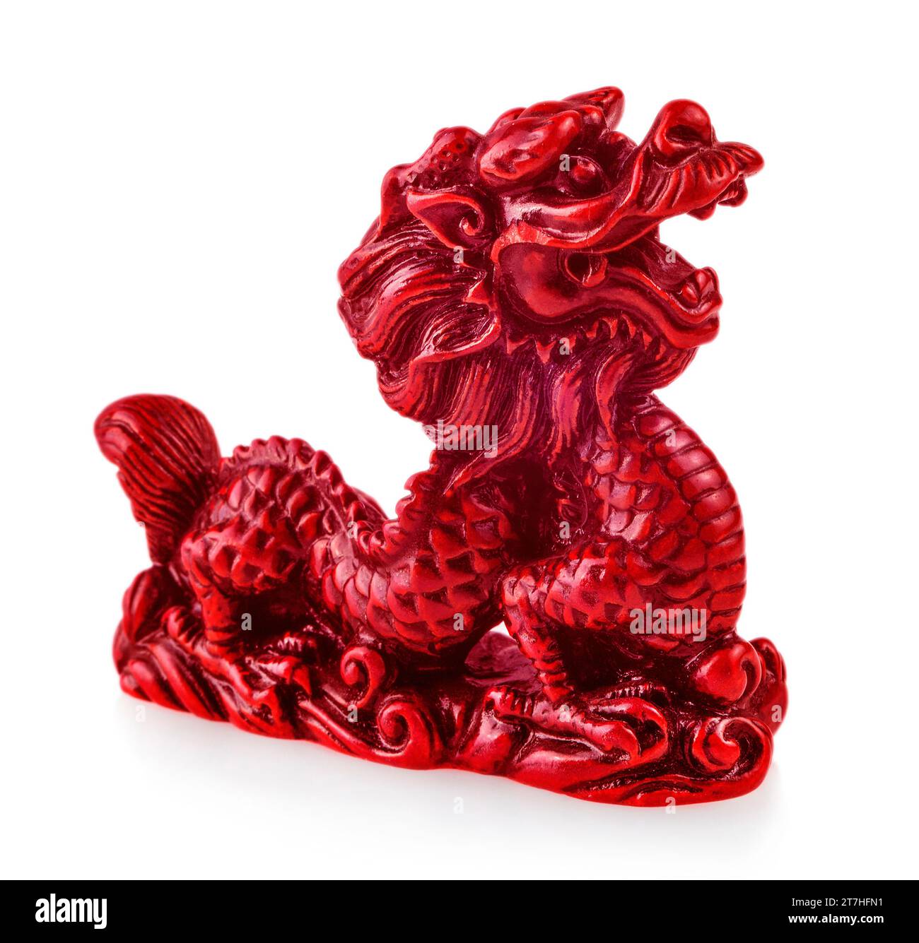 The small red dragon figurine isolated on white background Stock Photo ...