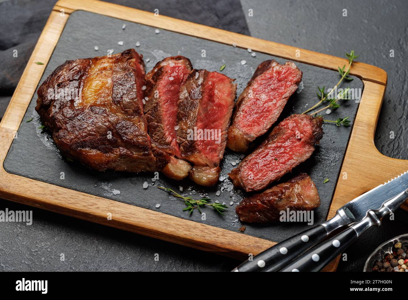 Deliciously juicy sliced beef ribeye steak, perfectly cooked and ready ...