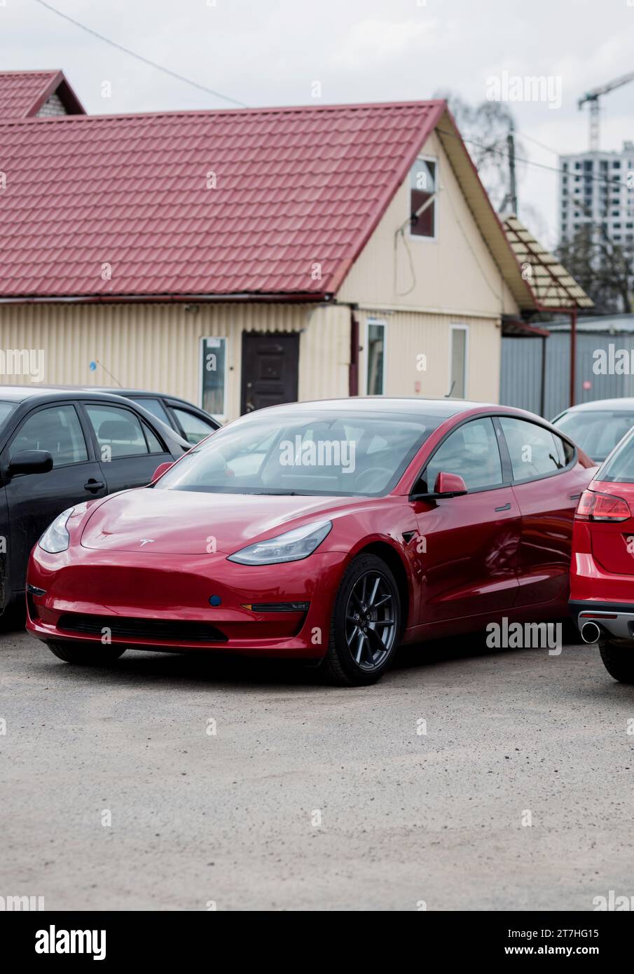 Minsk, Belarus, November, 16, 2023 - Red Tesla car in residential area ...