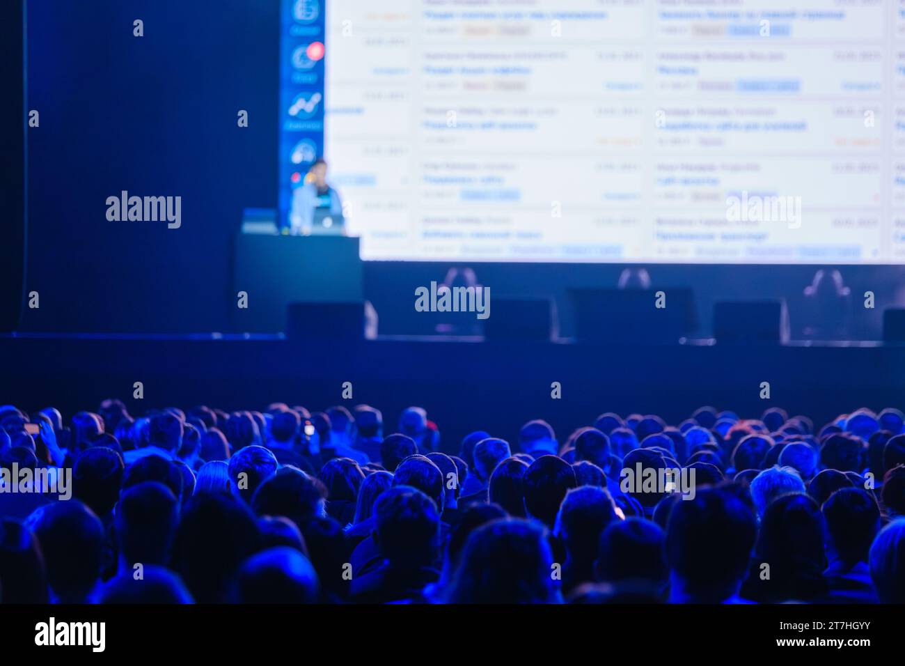 Back view of business crowd attending global presentation in ...