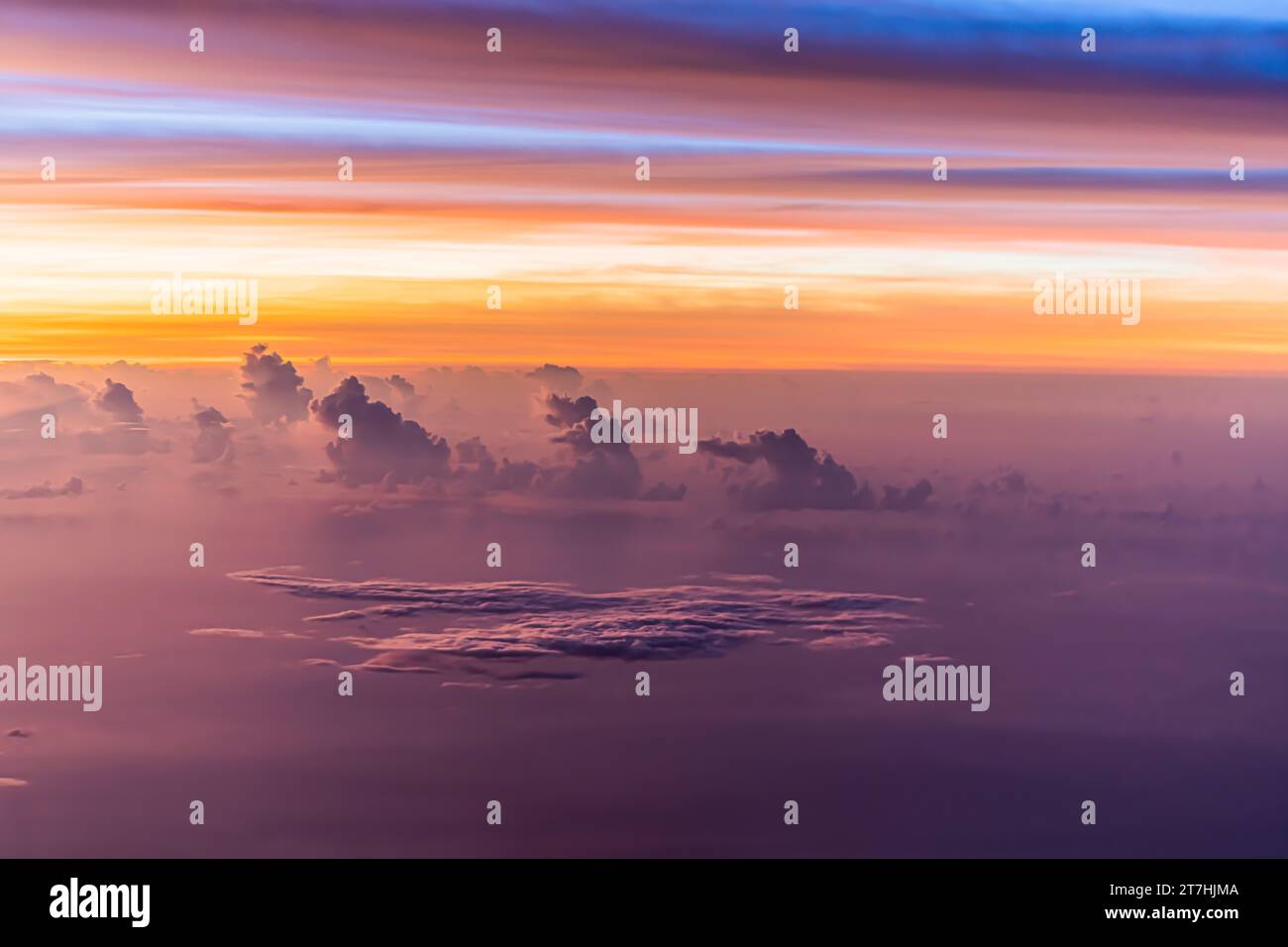A stunning sunset with colorful clouds floating in the sky Stock Photo ...