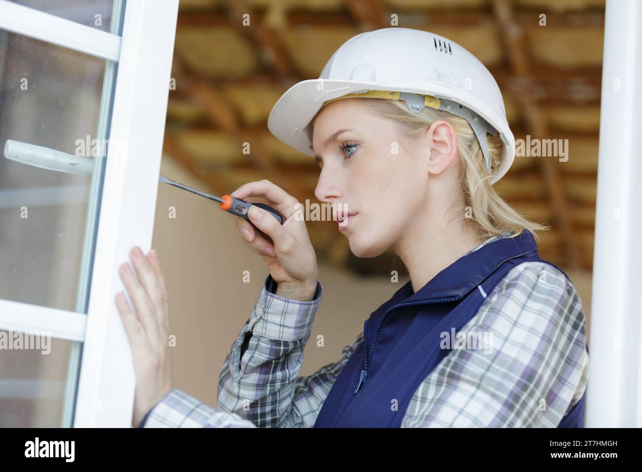 Woman locksmith fixing lock hi-res stock photography and images - Alamy