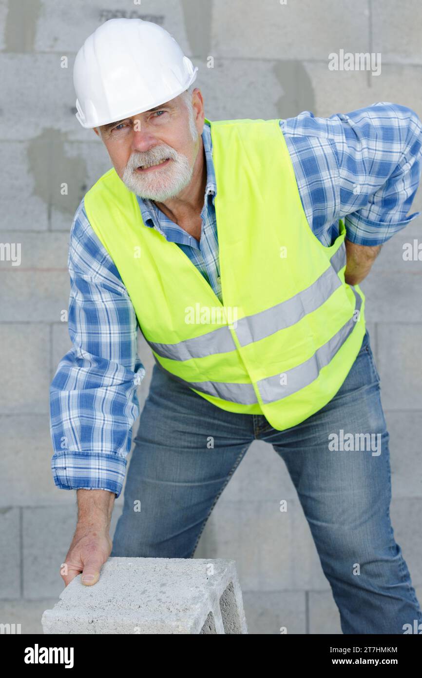 Construction worker suffering back hi-res stock photography and images ...