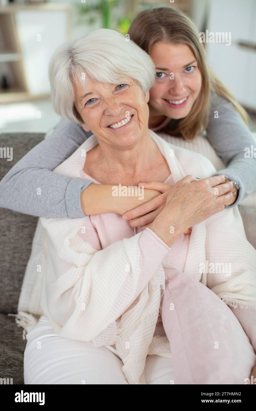 charming blonde lady hugging her mother Stock Photo - Alamy