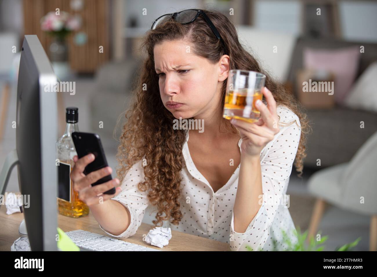 alcoholic business woman drinks at work Stock Photo - Alamy