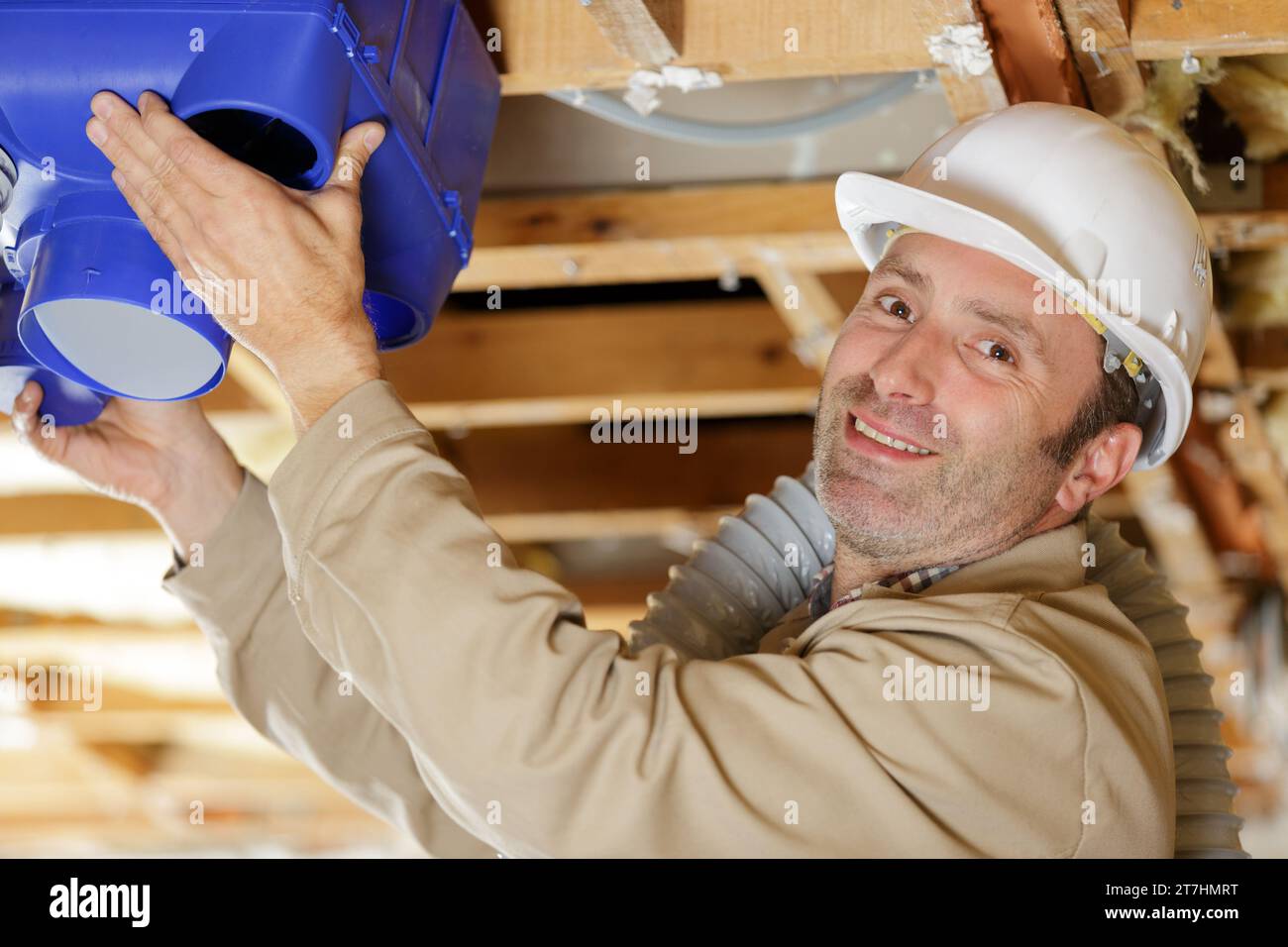 engineer showing ventilation piece to the camera Stock Photo - Alamy