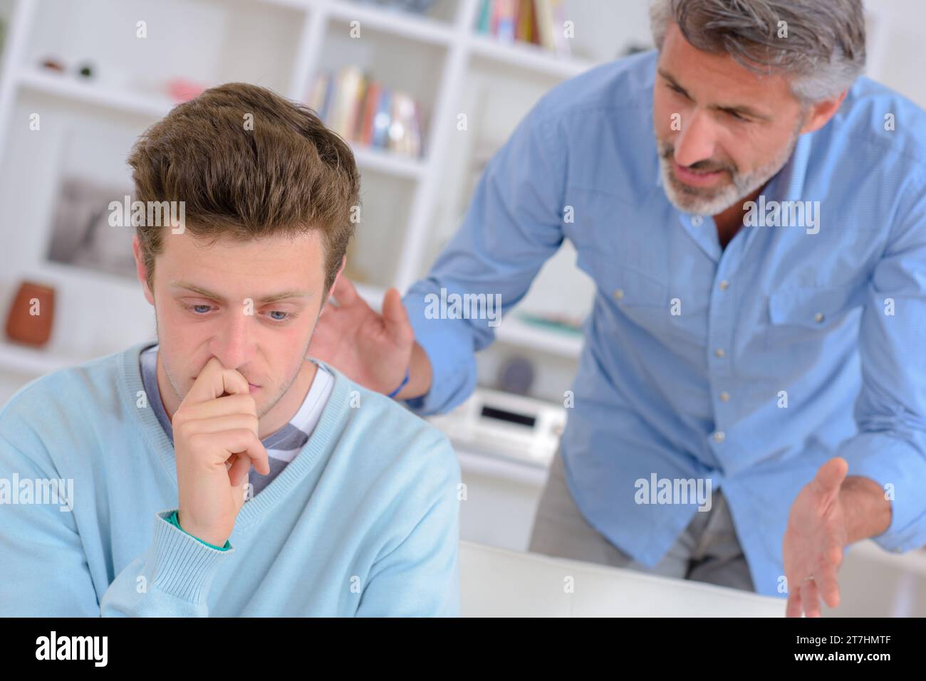 Teen father son talking sofa hi-res stock photography and images - Alamy