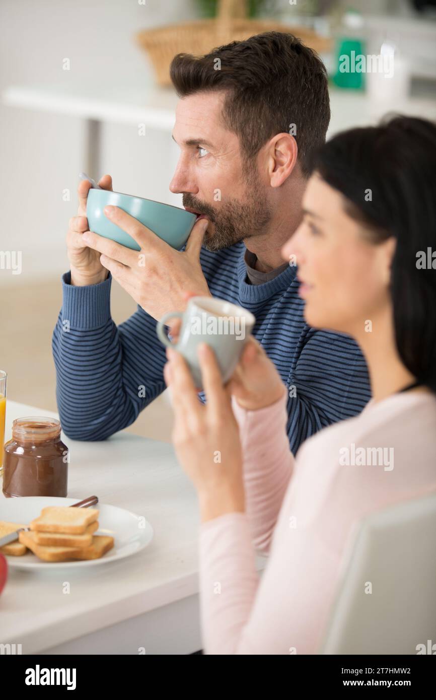 Distracted woman eating hi-res stock photography and images - Alamy