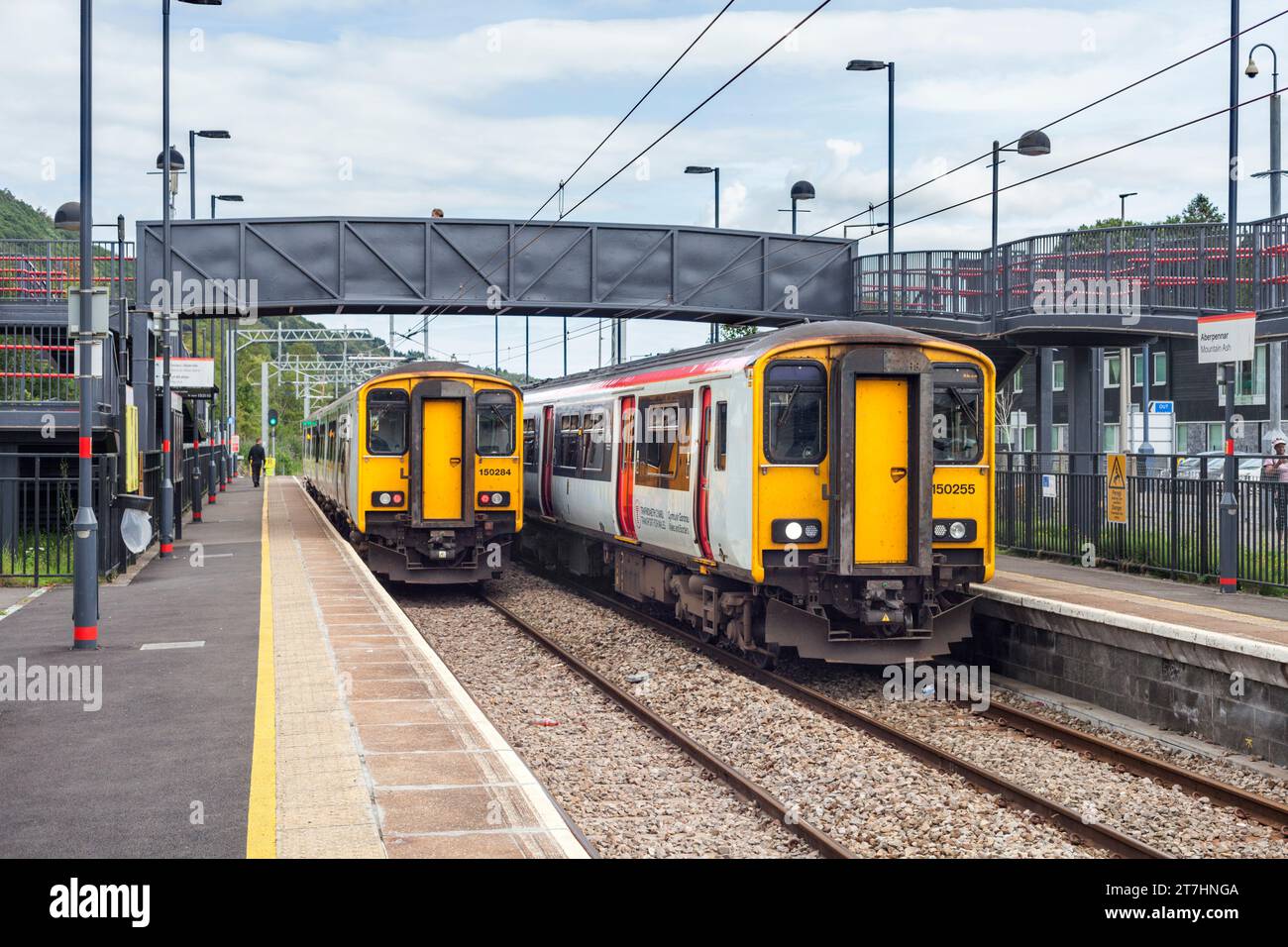 Transport For Wales class 150 diesel multiple unit trains passing at Mountain Ash Railway ...