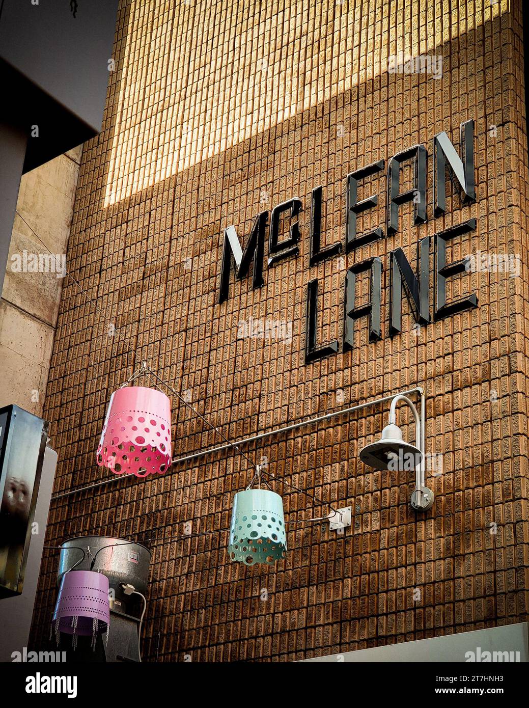 A modern style storefront signage advertising the name of a business ...